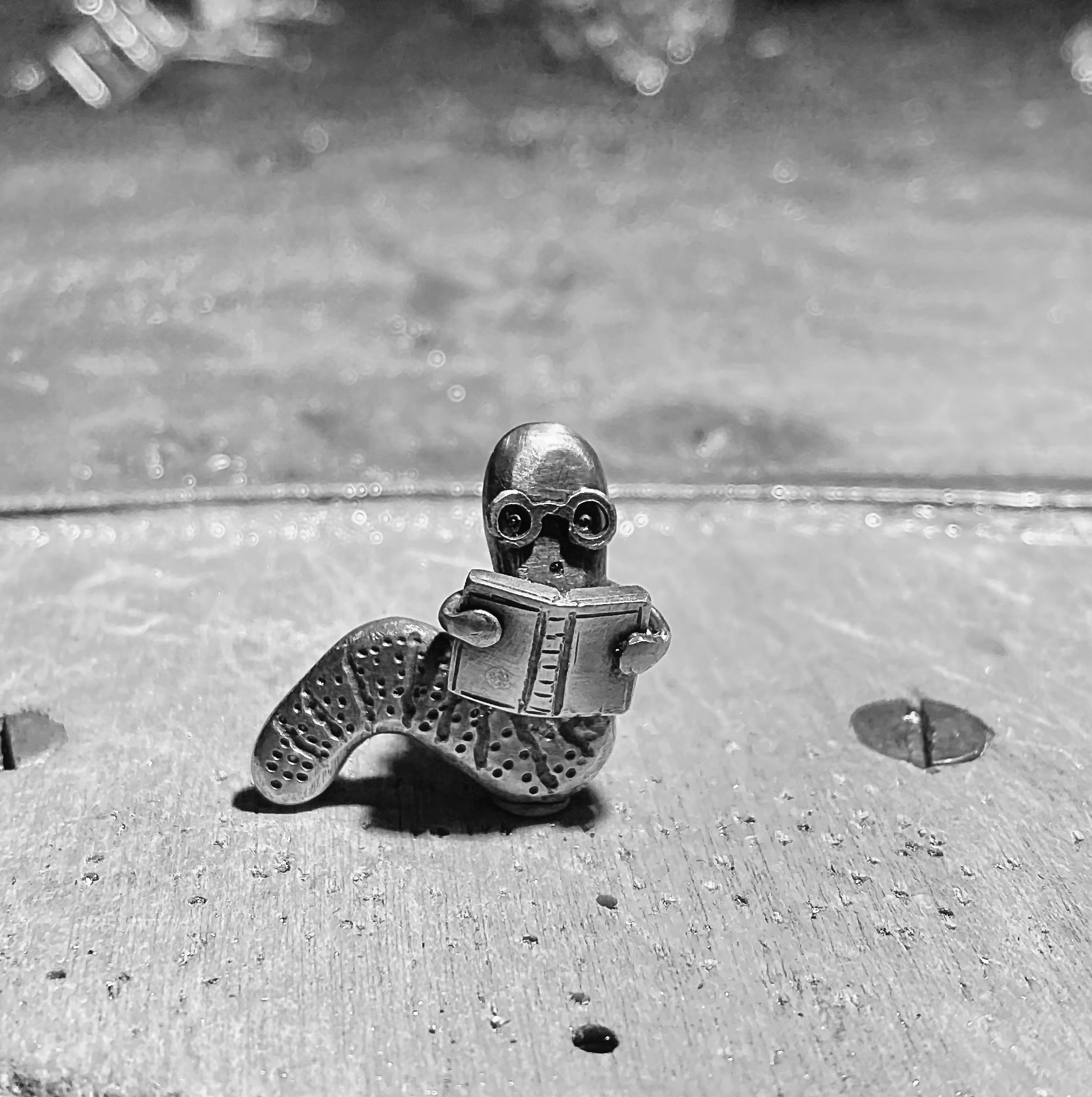 Book worm/ reading worm, maggot, pendant - Harri Syrjänen